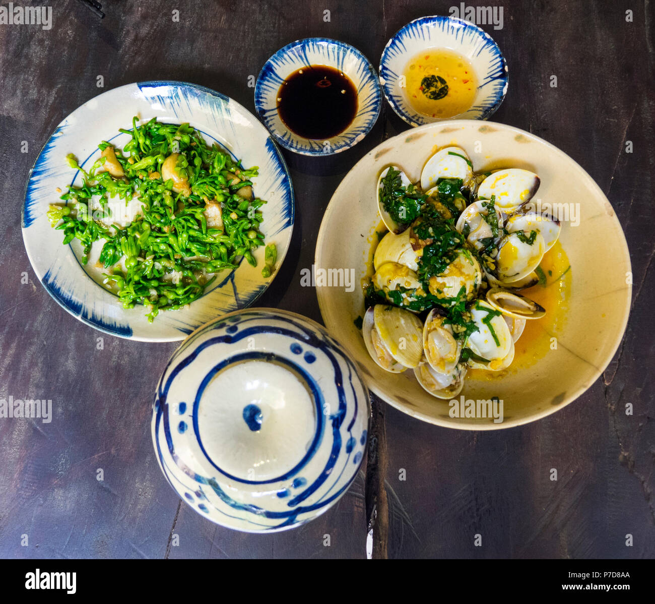 Vietnamese cuisine, green vegetales and cockle shells Stock Photo - Alamy