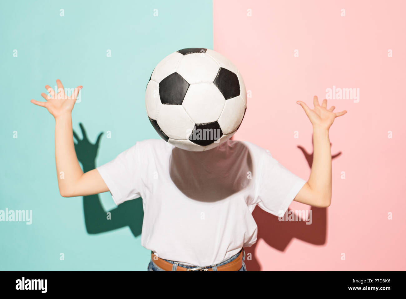 The young fan with ball instead of head on blue and pink trendy colors ...