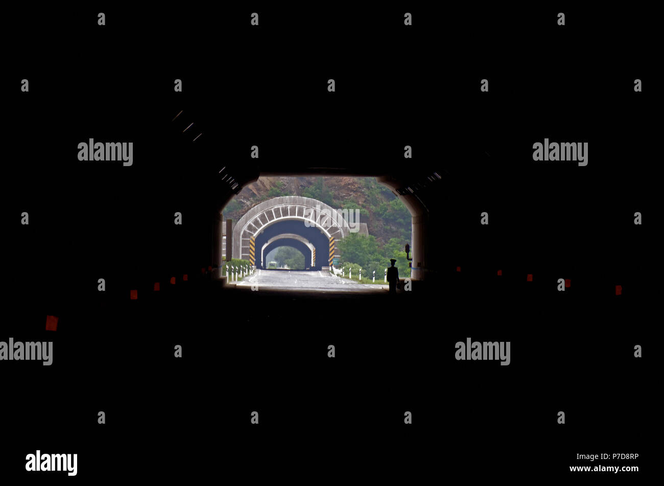 Silhouette of a man walking through tunnels on the empty Kaesong ...