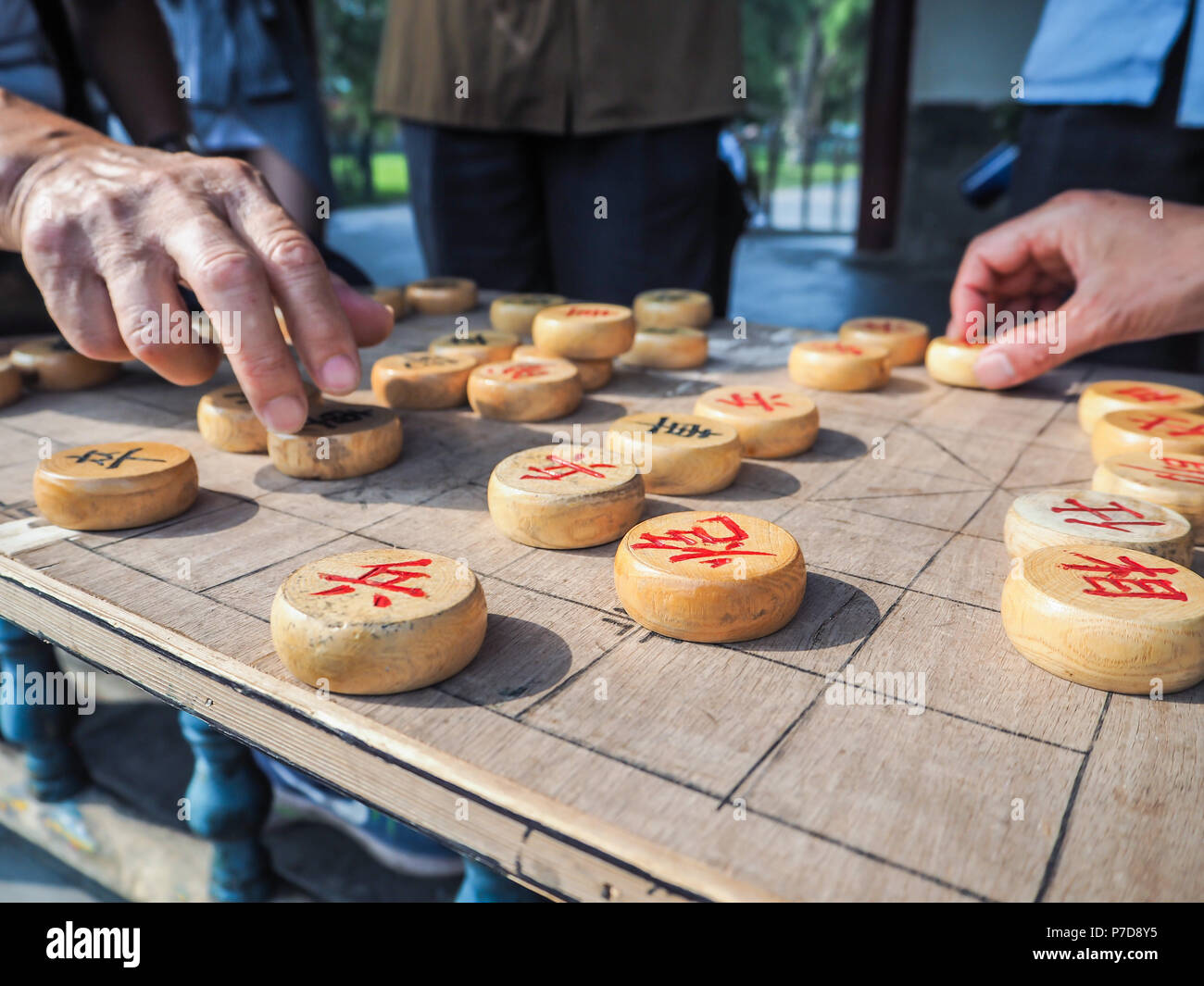 Older men playing traditional Chinese chess in the long corridor of the ...