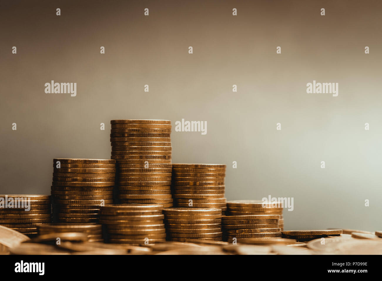 Savings, increasing columns of coins, piles of coins arranged as a ...