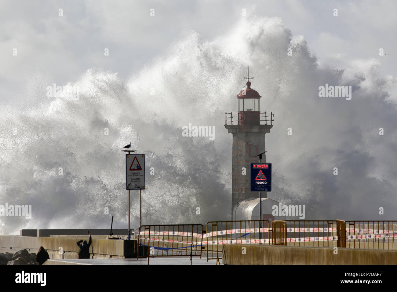 Douro river mouth old pier and lighthouse during heavy stormy seeing ...