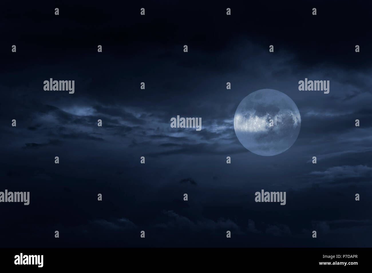 Blue cloudy full moon night sky Stock Photo - Alamy