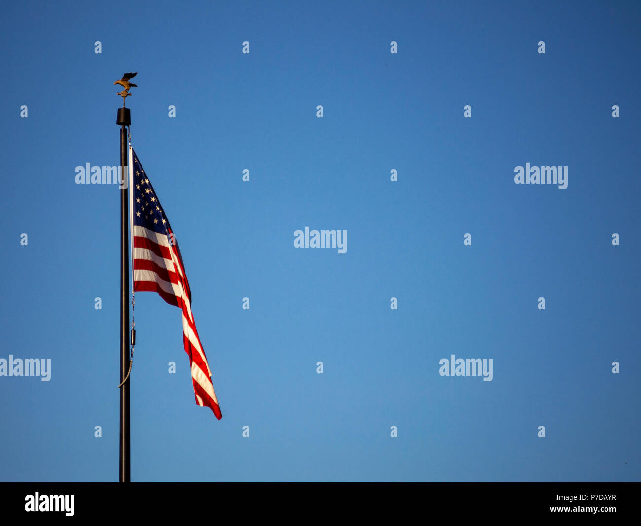 American flag blowing in breeze hi-res stock photography and images - Alamy