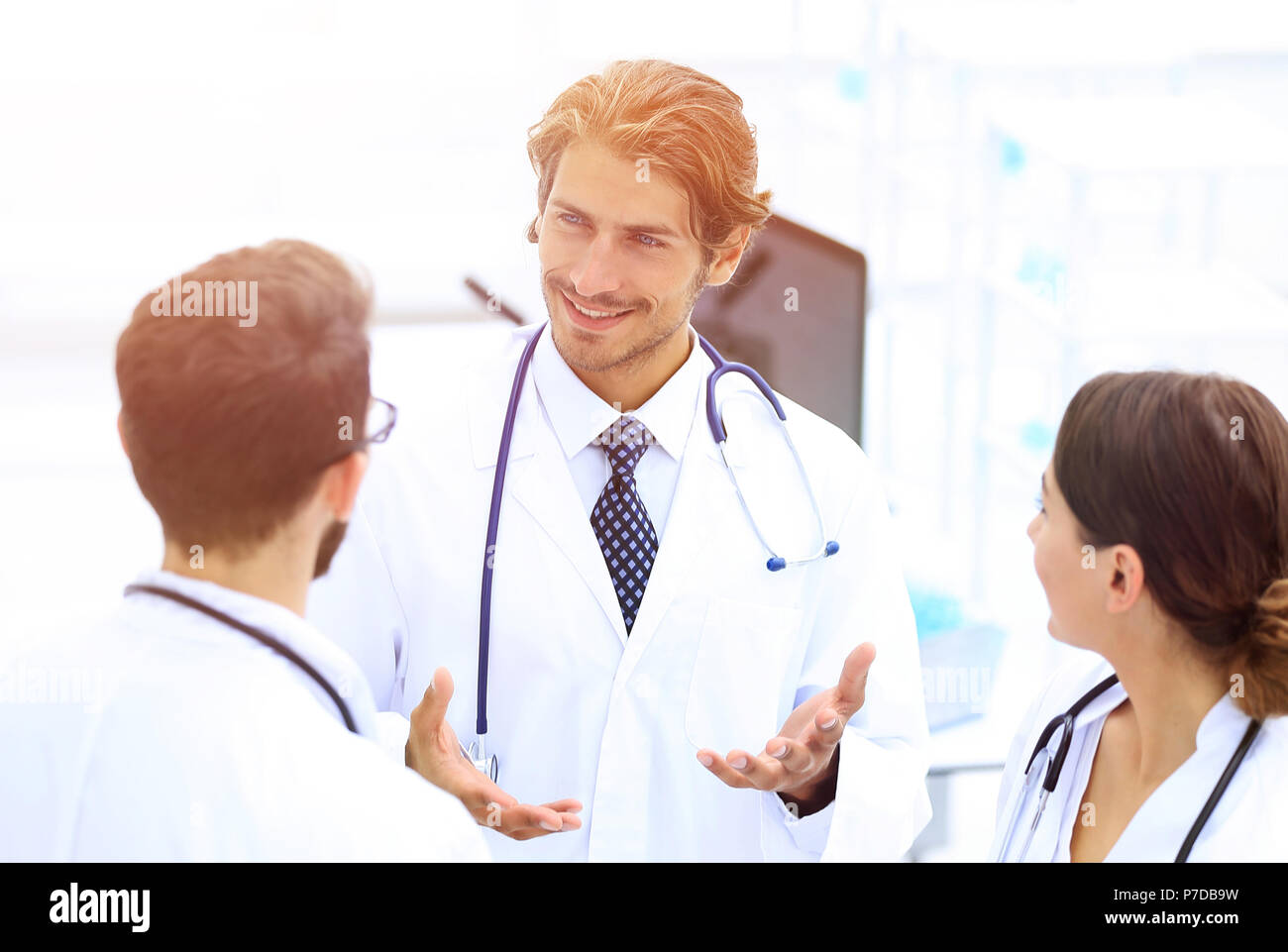Group of doctors talking Stock Photo - Alamy