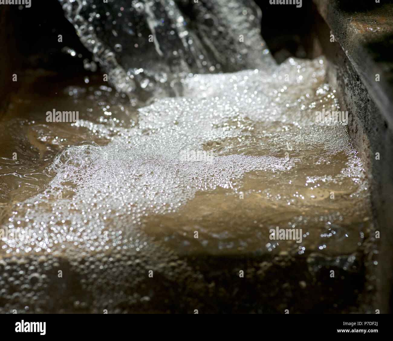 Gemstone panning with a sluice box. Sifting for stones and fossils at ...