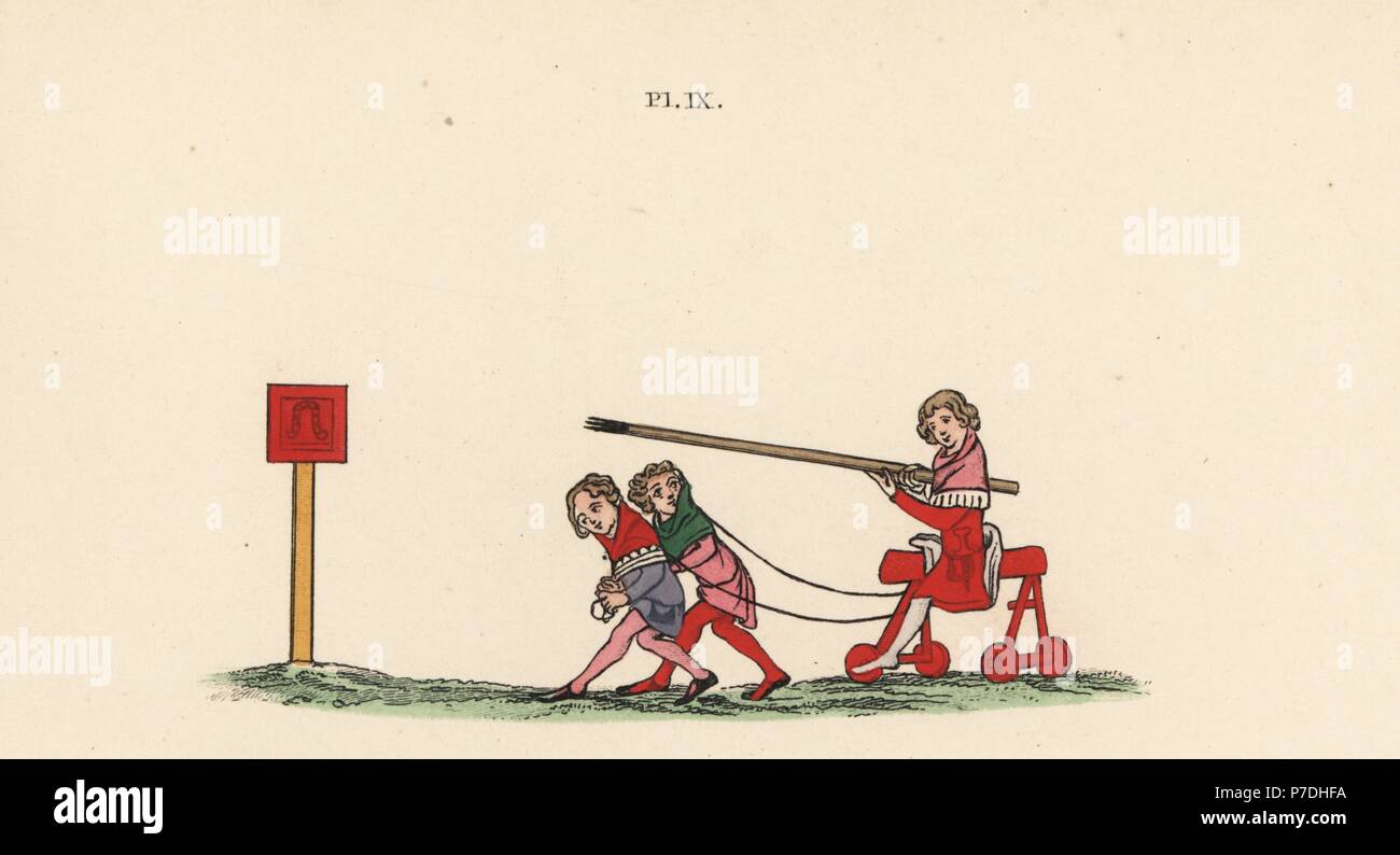 Boy on rolling trestle pulled by two other boys to tilt with a lance at ...