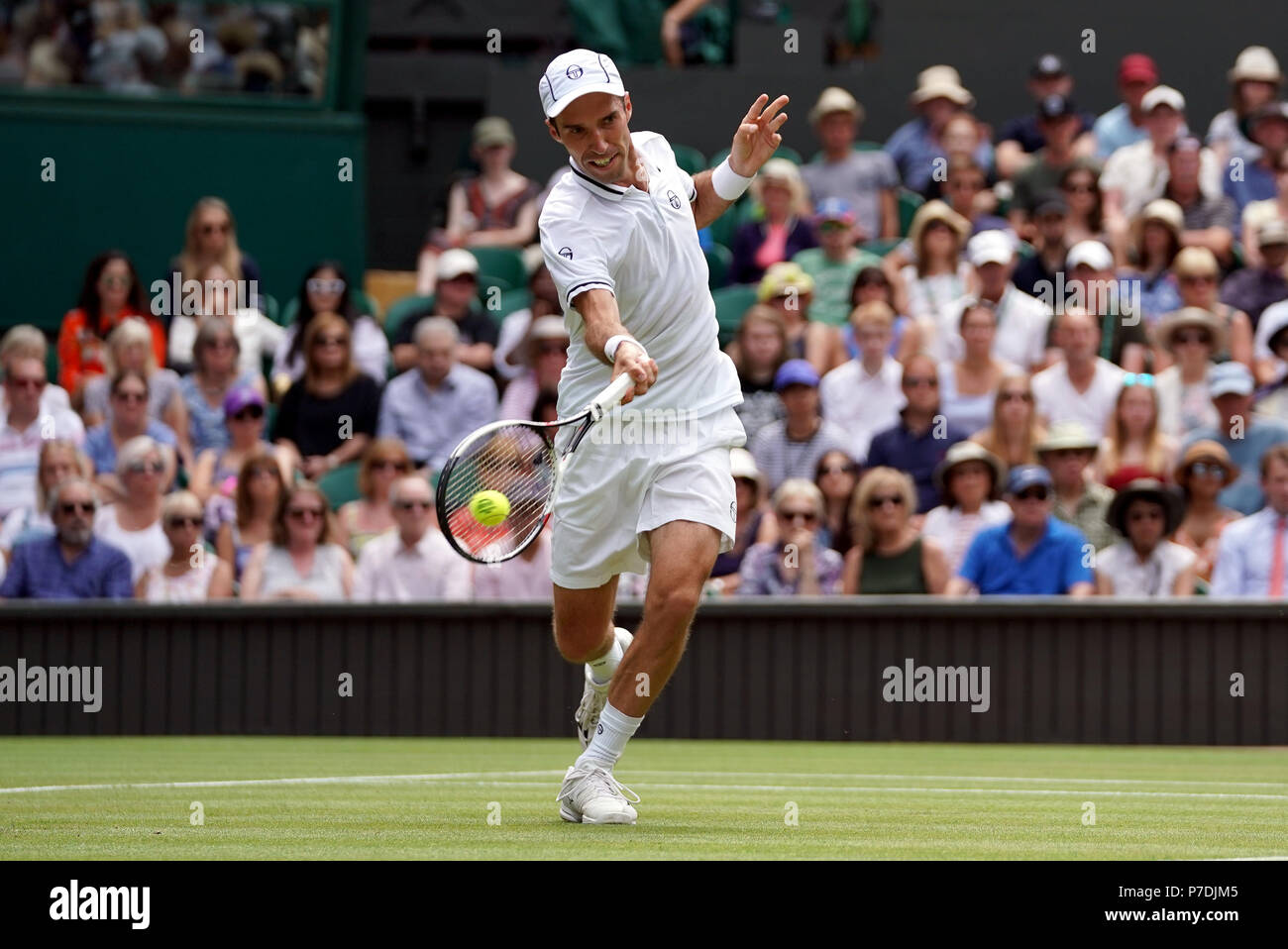 Mikhail Kukushkin in action on day four of the Wimbledon Championships ...