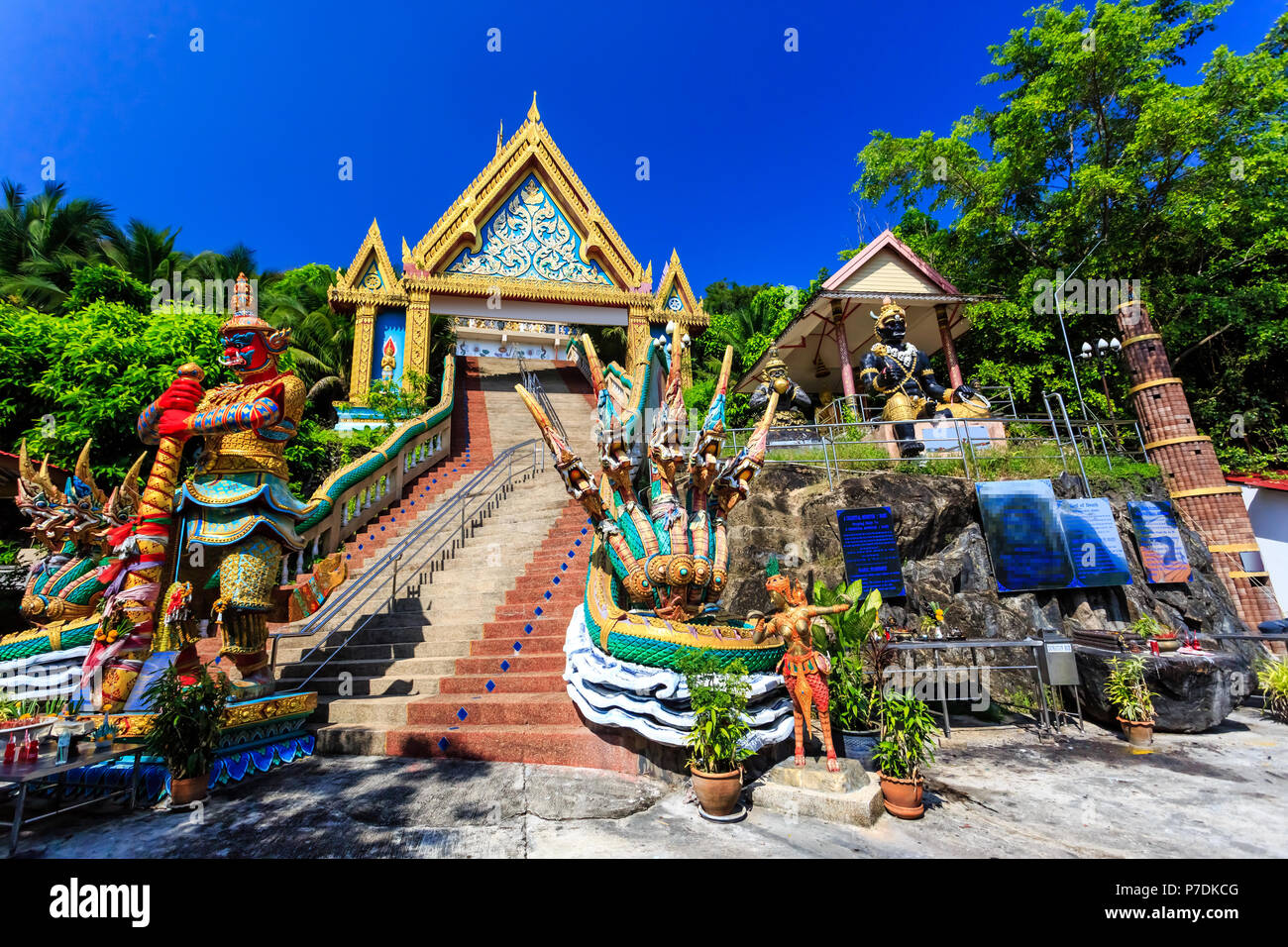 The main stairs leading to Wat Khao Rang temple with boards description ...