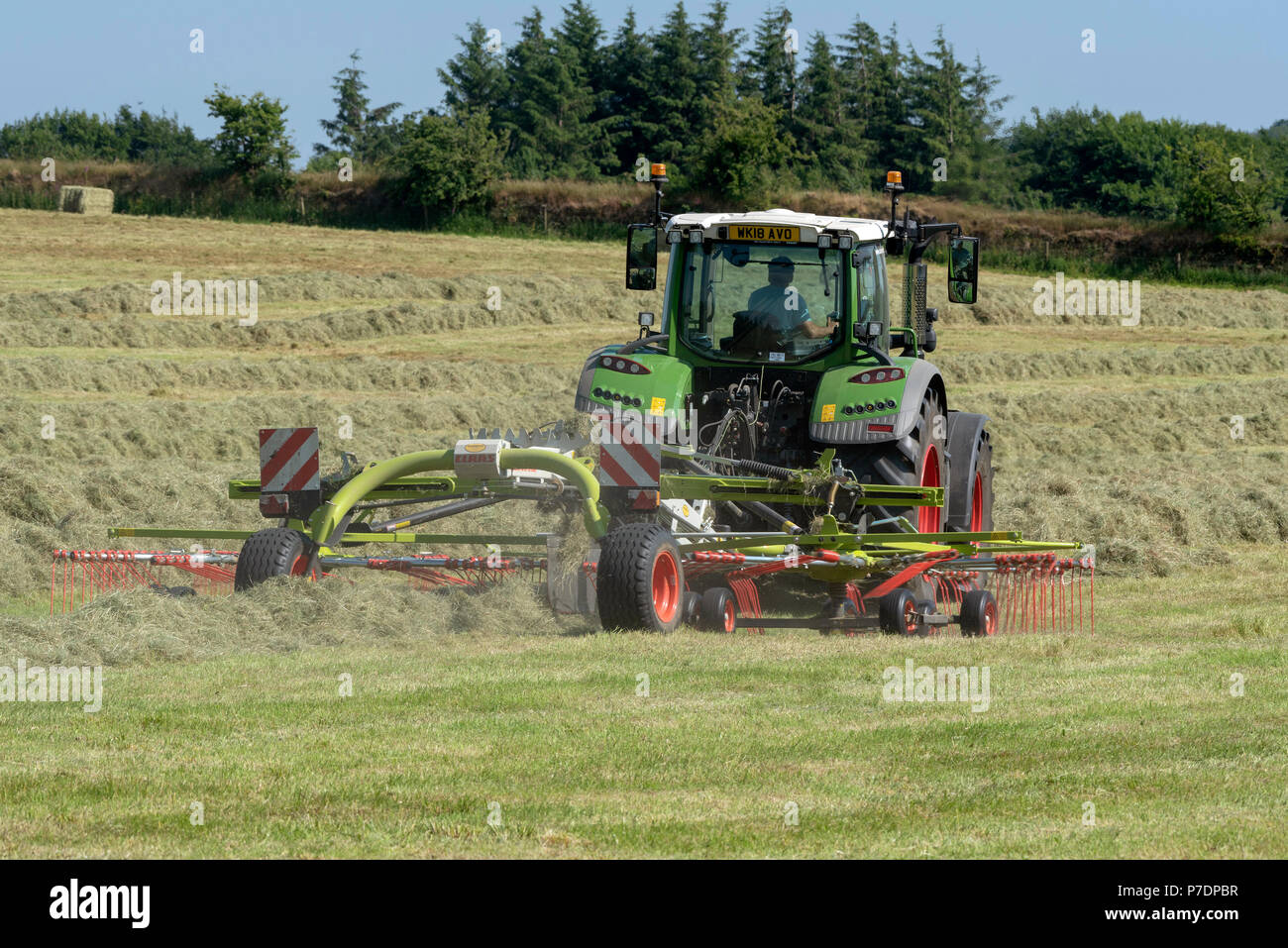 Dartmoor, Devon, England, UK Haymaking on a Devonshire farm using a ...