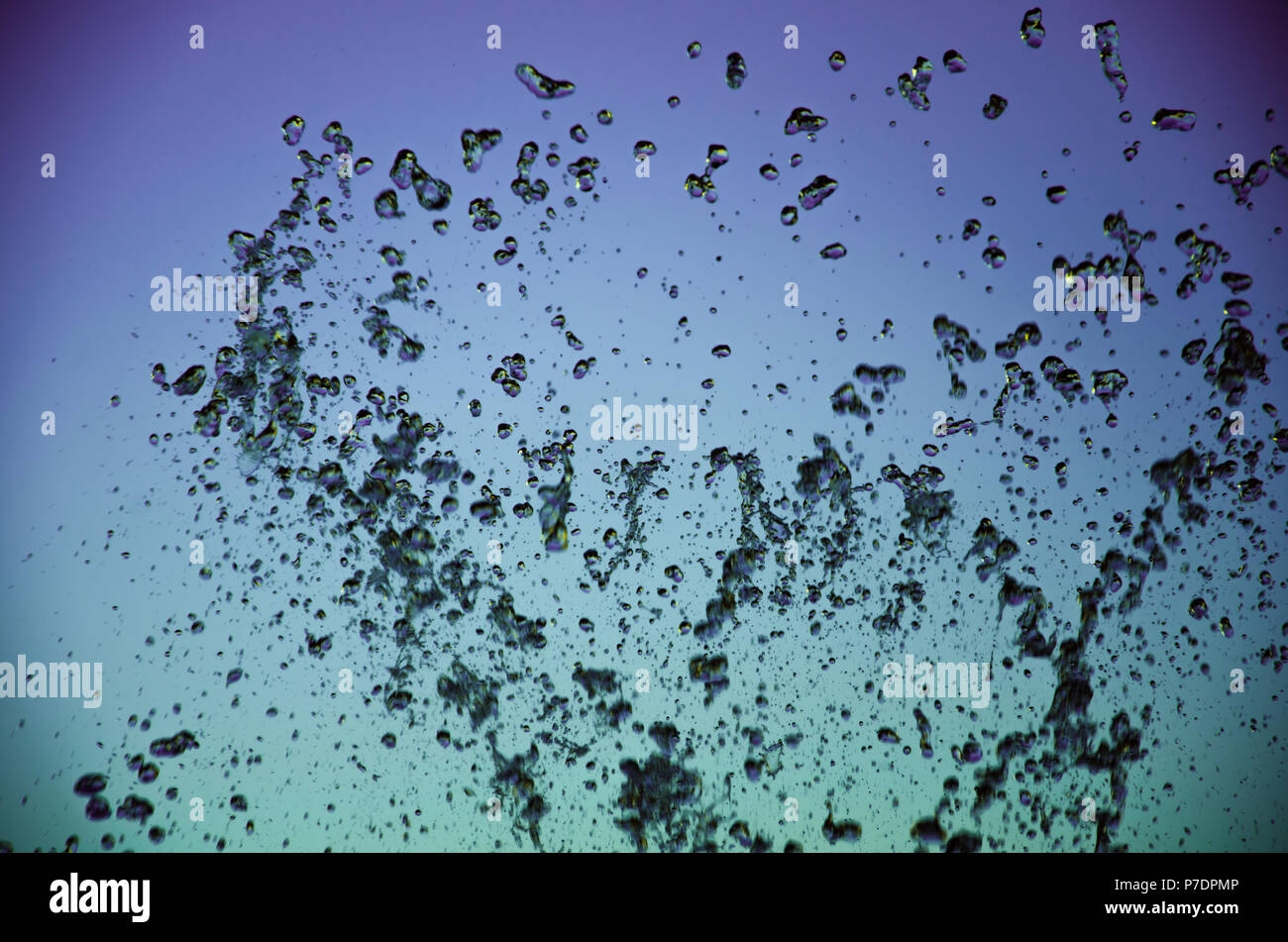 Abstract liquid drops on blue background Stock Photo - Alamy