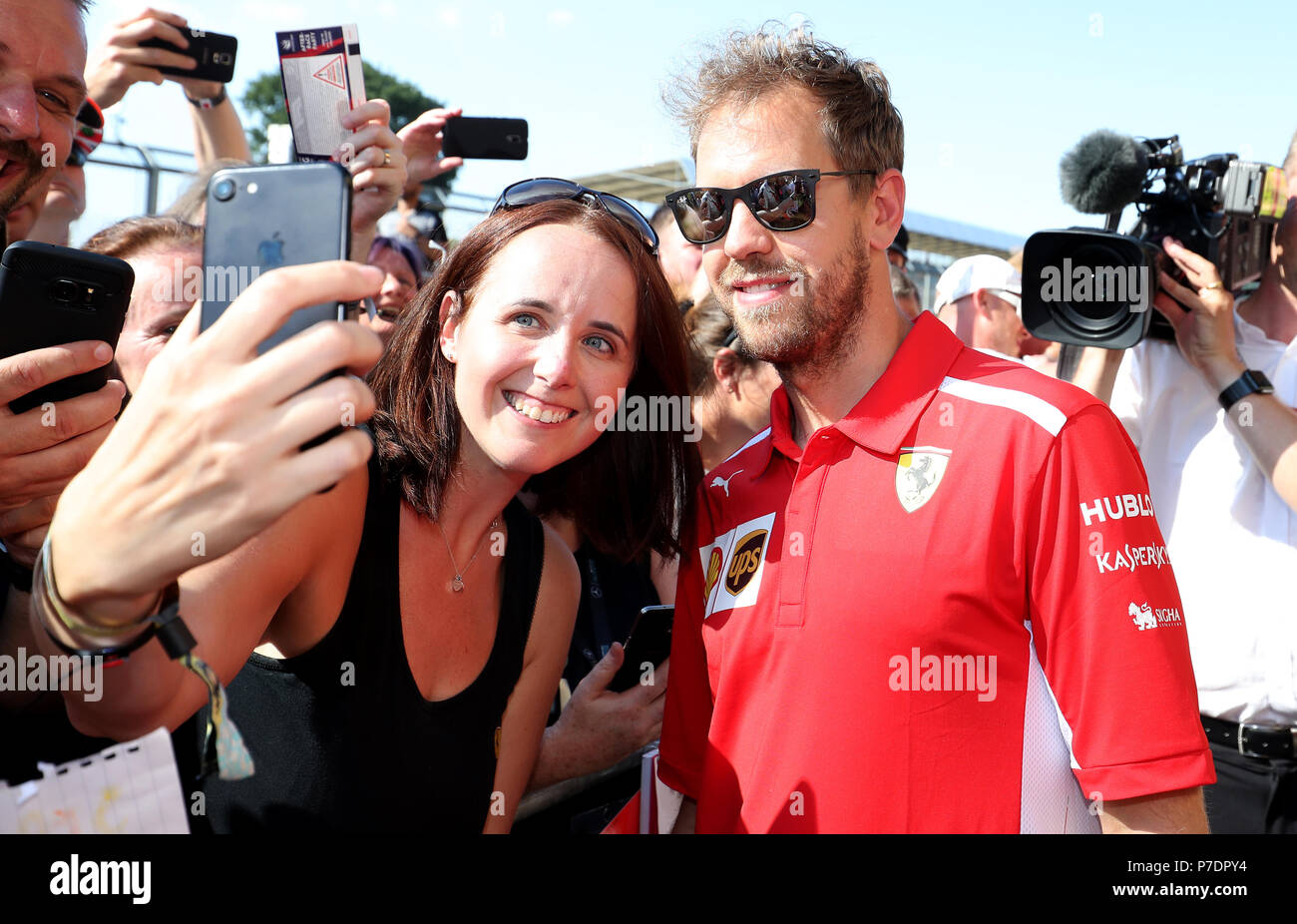 Ferrari's Sebastian Vettel poses for a photo during the paddock day for ...