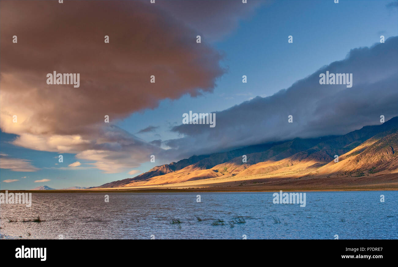Big cloud in front of Steens Mountain, rising 5,000 feet above Mann ...