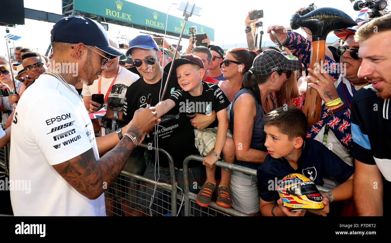 Lewis hamilton signs autographs for fans at silverstone hi-res stock ...