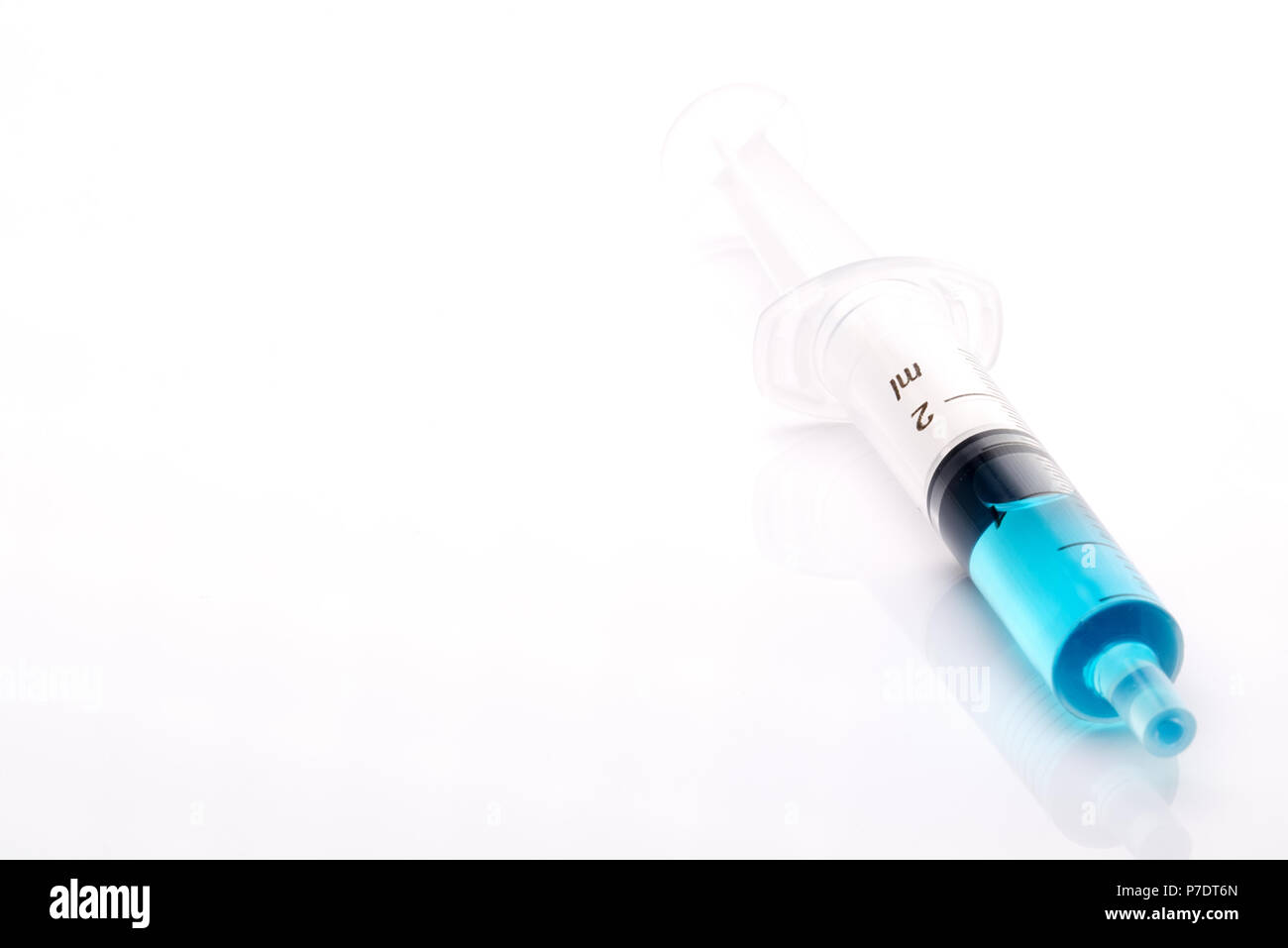 Clear plastic syringe containing blue liquid (Copper sulfate solution ...