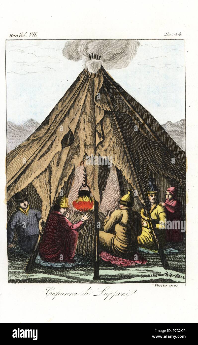 A family of Lapps around a fire in a hut made of wood beams covered ...