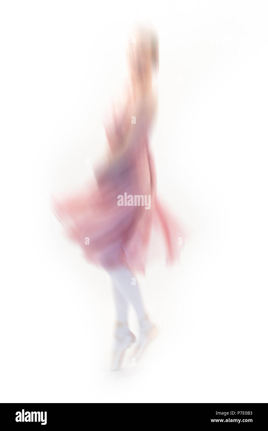 Blurred young ballet dancer posing on white background Stock Photo - Alamy