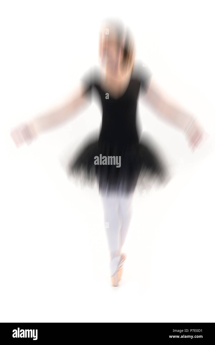 Blurred young ballet dancer posing on white background Stock Photo - Alamy
