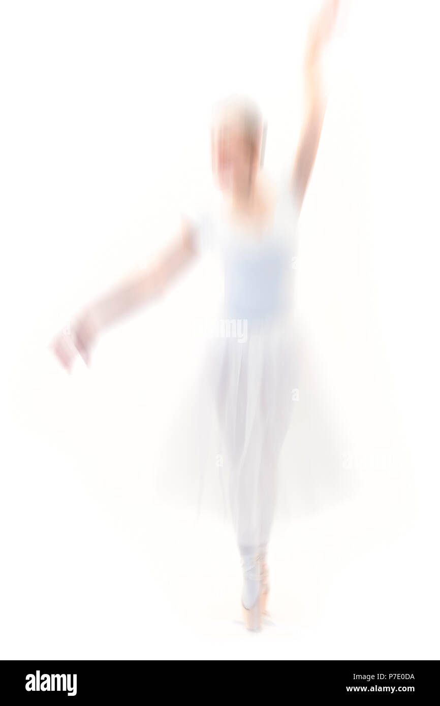 Blurred young ballet dancer posing on white background Stock Photo - Alamy