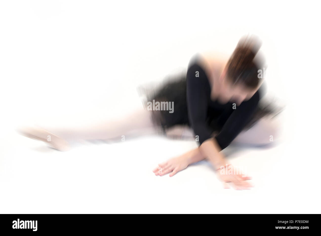 Blurred young ballet dancer posing on white background Stock Photo - Alamy