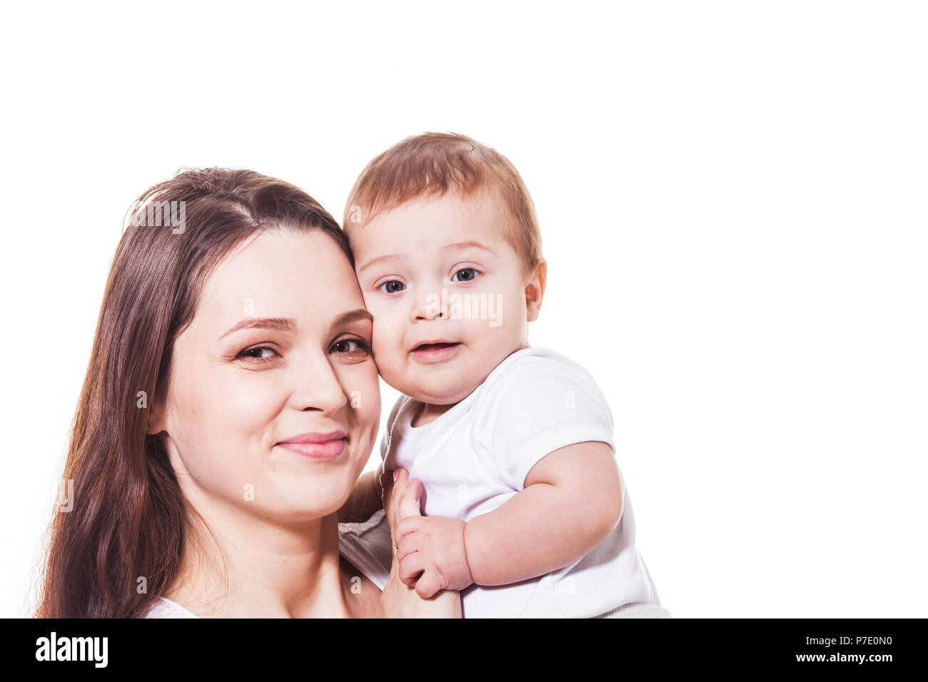 Adorable mother and child looking at the camera Stock Photo - Alamy
