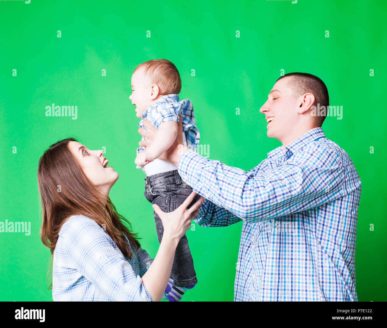 Family on green background Stock Photo - Alamy