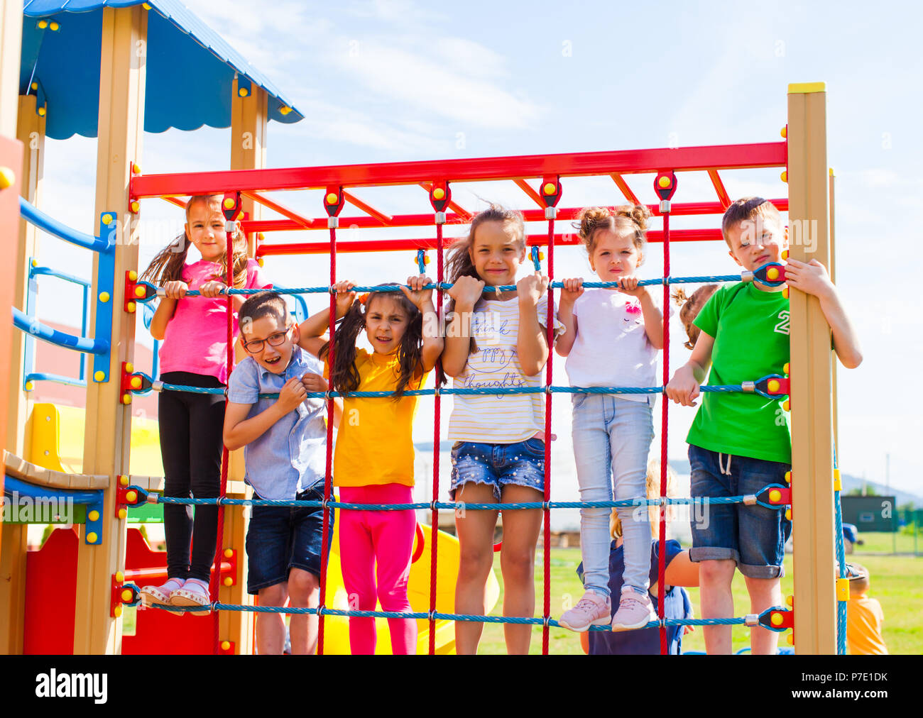 Group of children climbing the net Stock Photo - Alamy