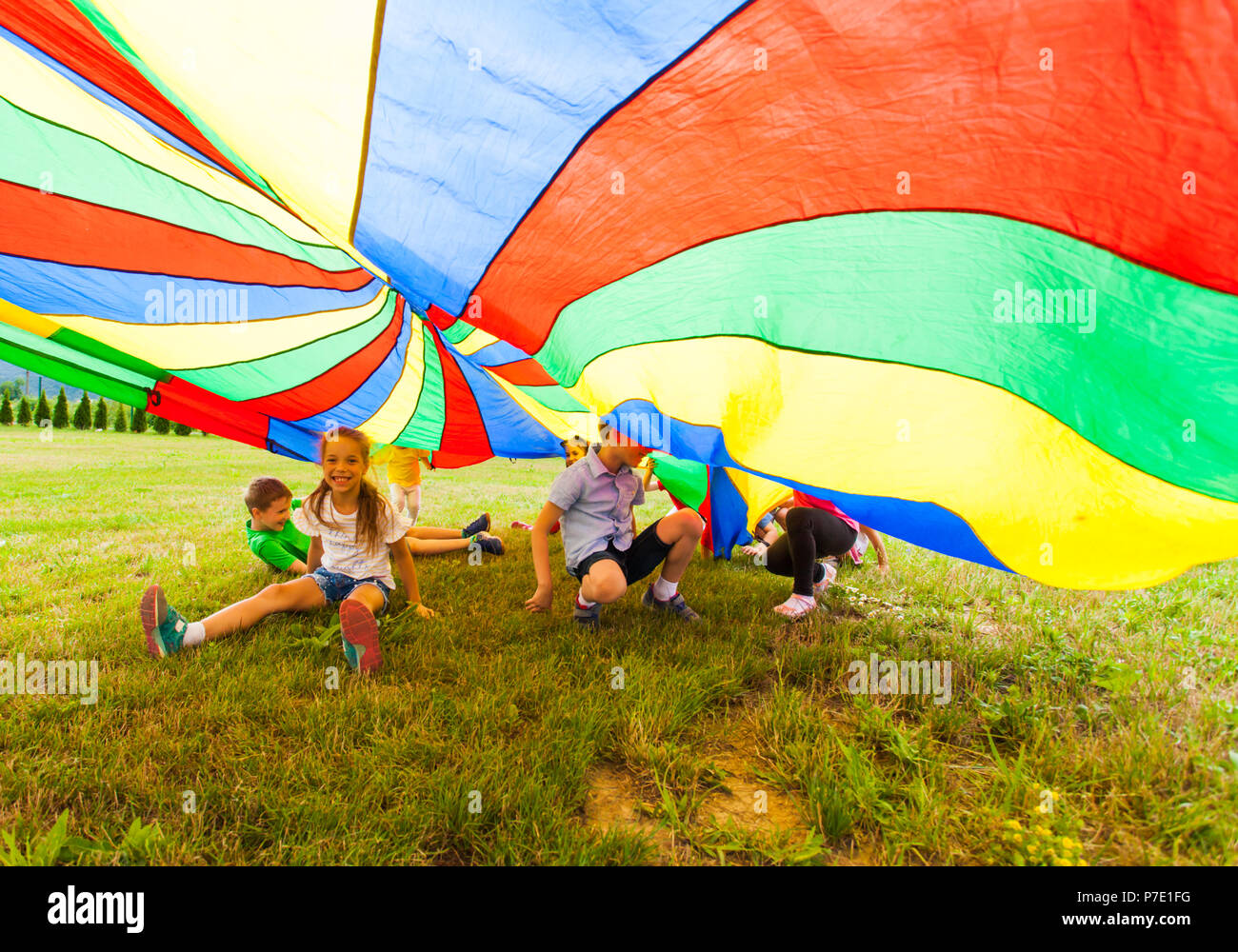 Girl under parachute hi-res stock photography and images - Alamy