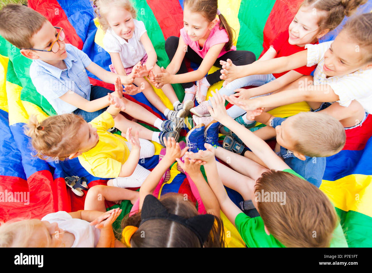Group of children siting in a circle Stock Photo - Alamy