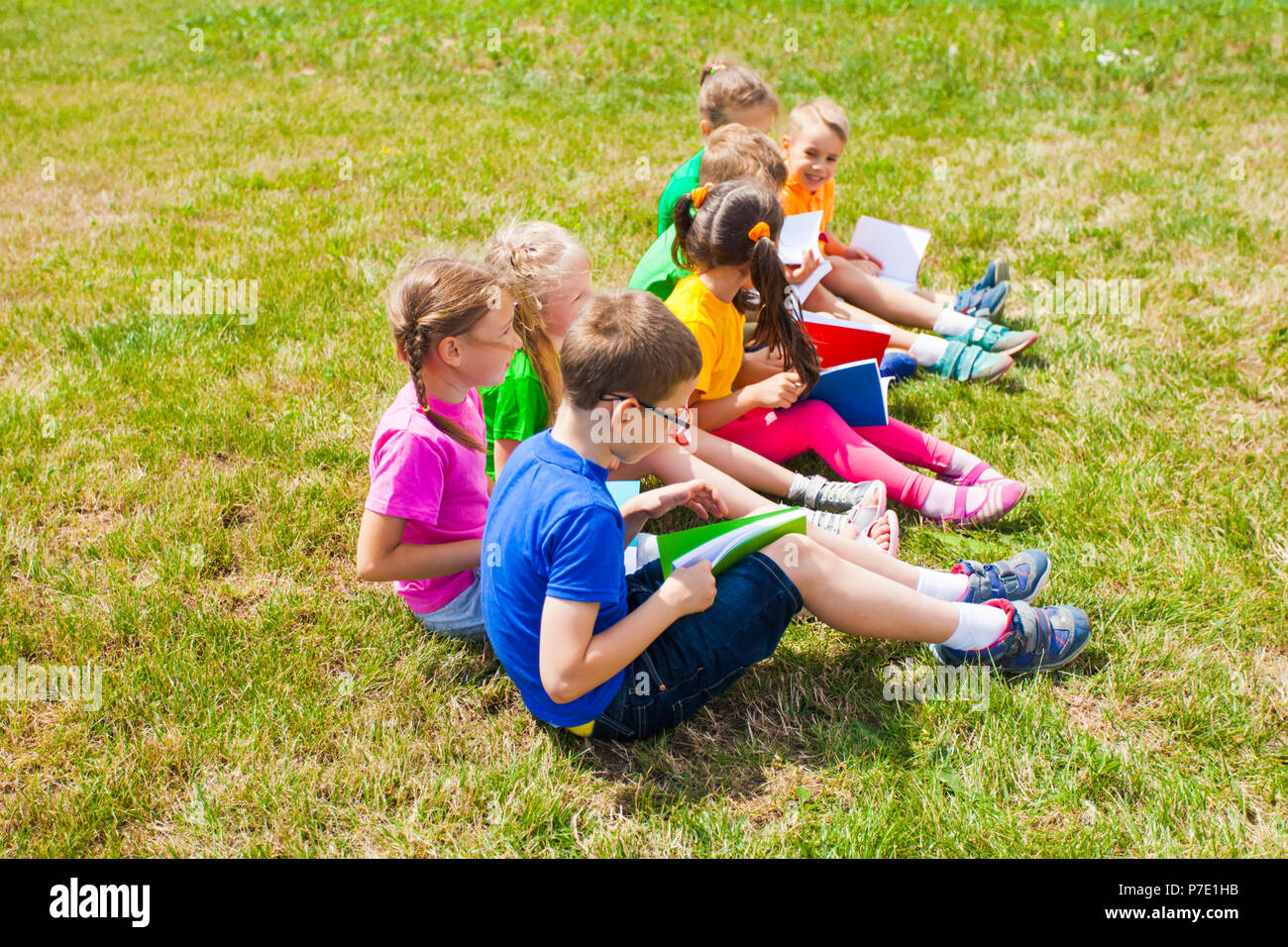 Kids with their favorite books Stock Photo - Alamy