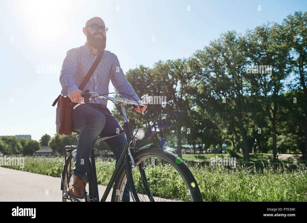Man riding bicycle hi-res stock photography and images - Alamy