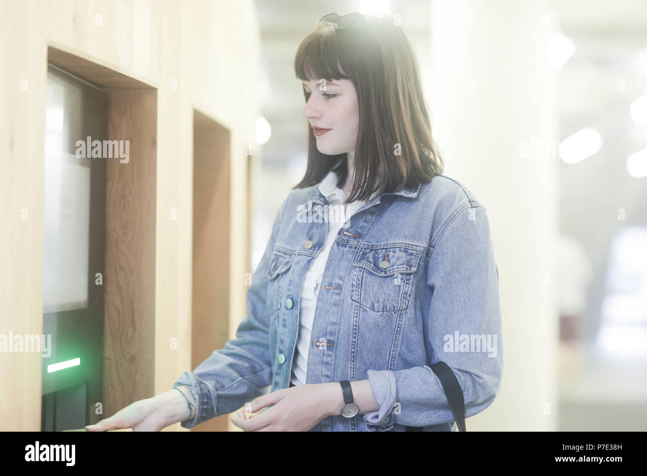 Woman using fingerprint sensor Stock Photo - Alamy