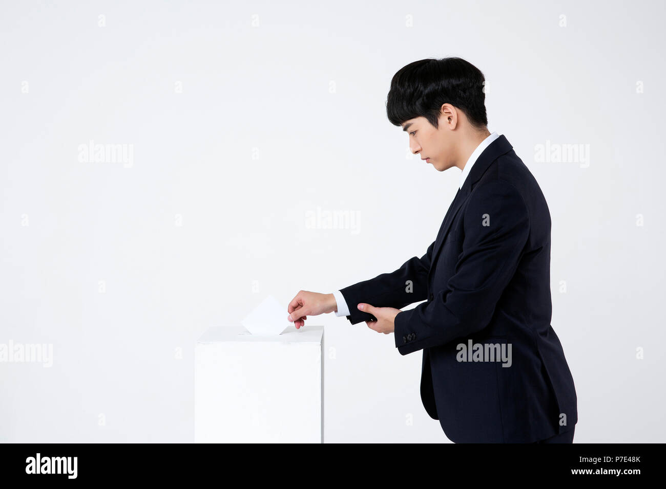 RF Photos- take a vote, the man is voting isolated on white background ...