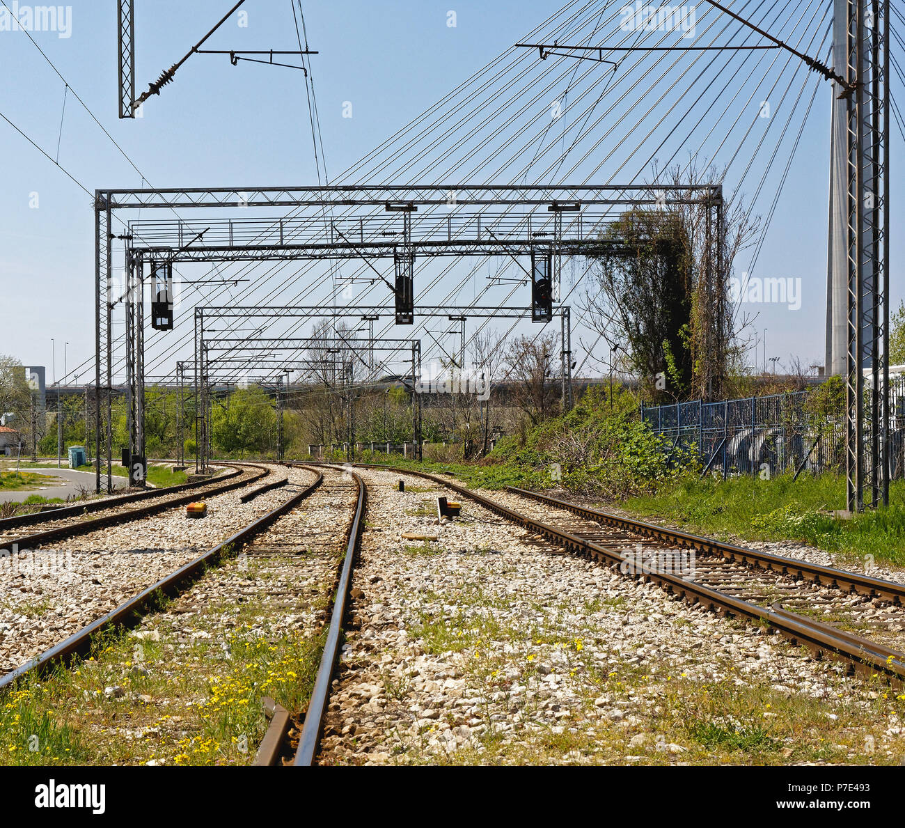 Three Rail Tracks Railway With Overhead Electrical Train Line Stock ...