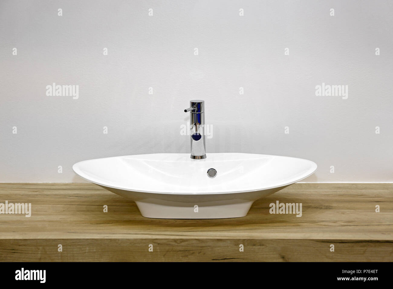Ceramic Wash Basin at Wooden Counter in Contemporary Bathroom Stock ...
