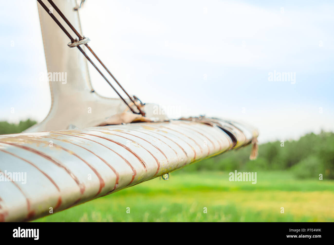 the old plane stands on the field with broken wings Stock Photo - Alamy