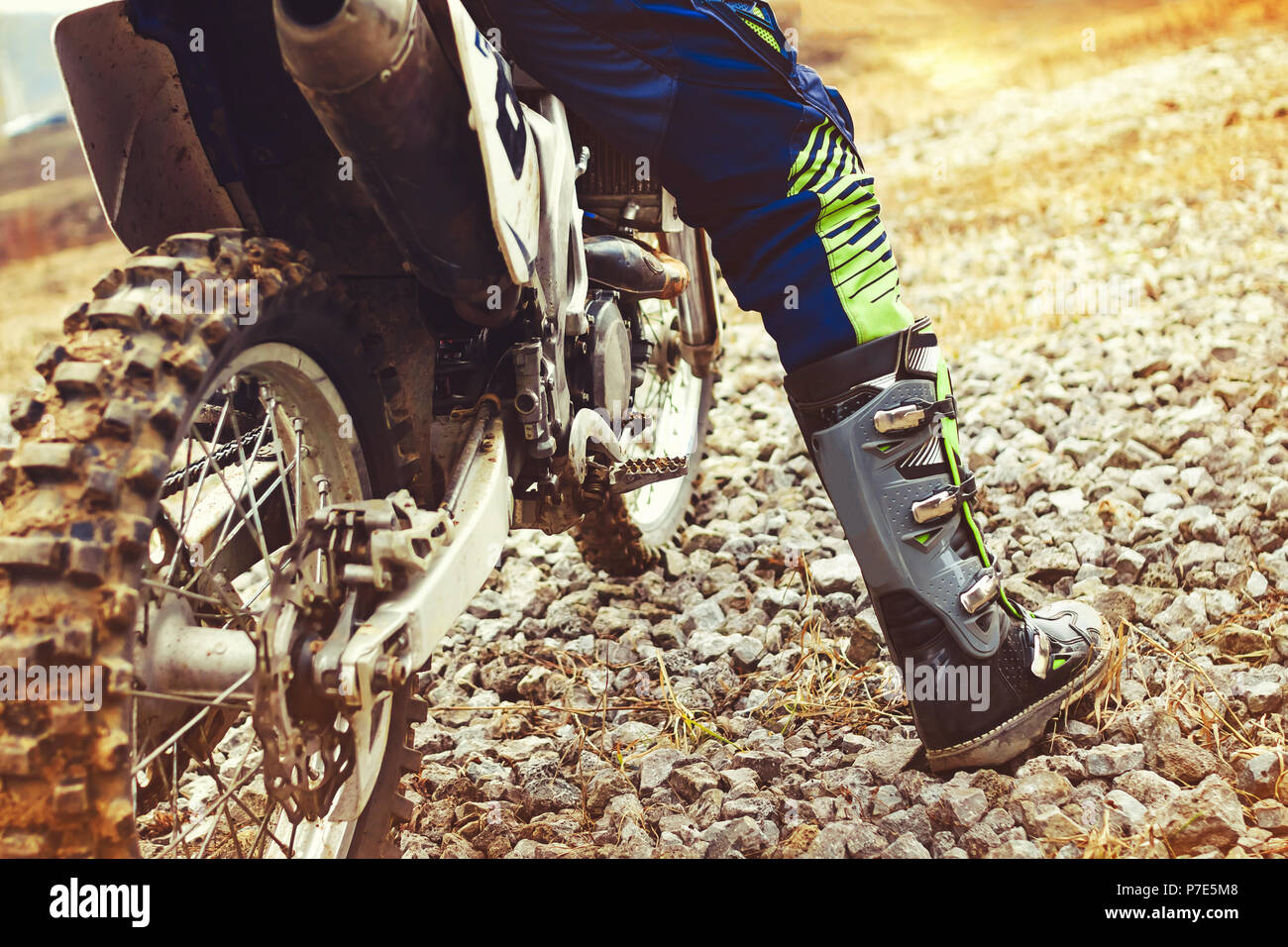 Close-up of biker sitting on motorcycle in starting point before the ...