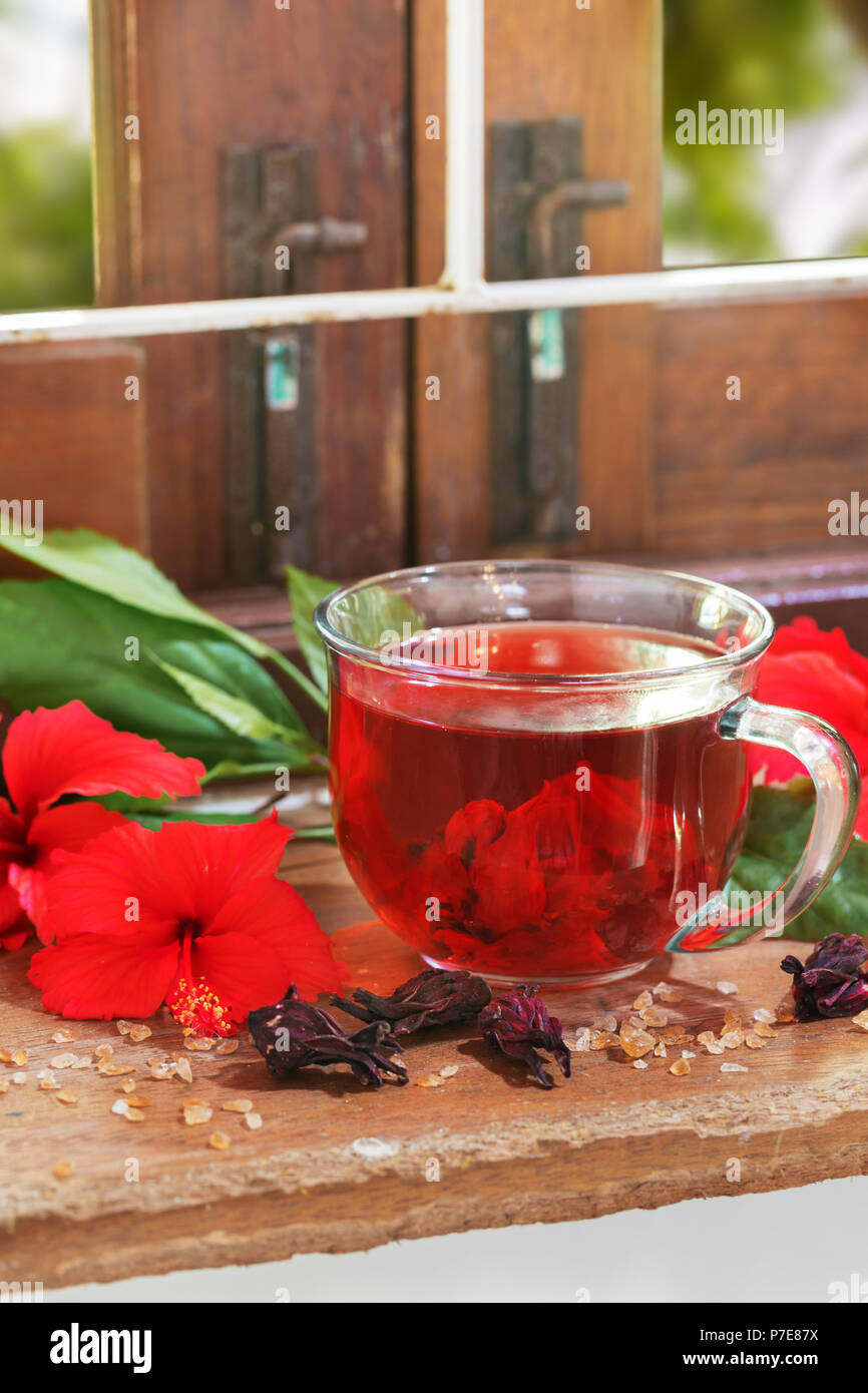 Red karkade hibiscus red sorrel tea in glass mug with dry tea cu Stock ...