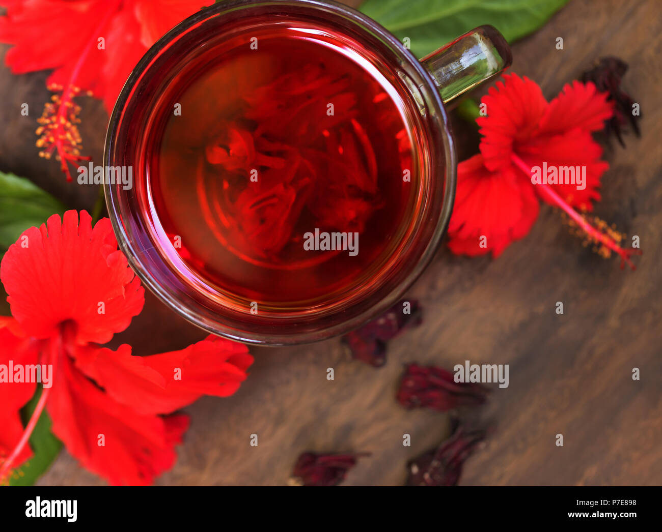 Red karkade hibiscus red sorrel tea in glass mug with dry tea cu Stock ...