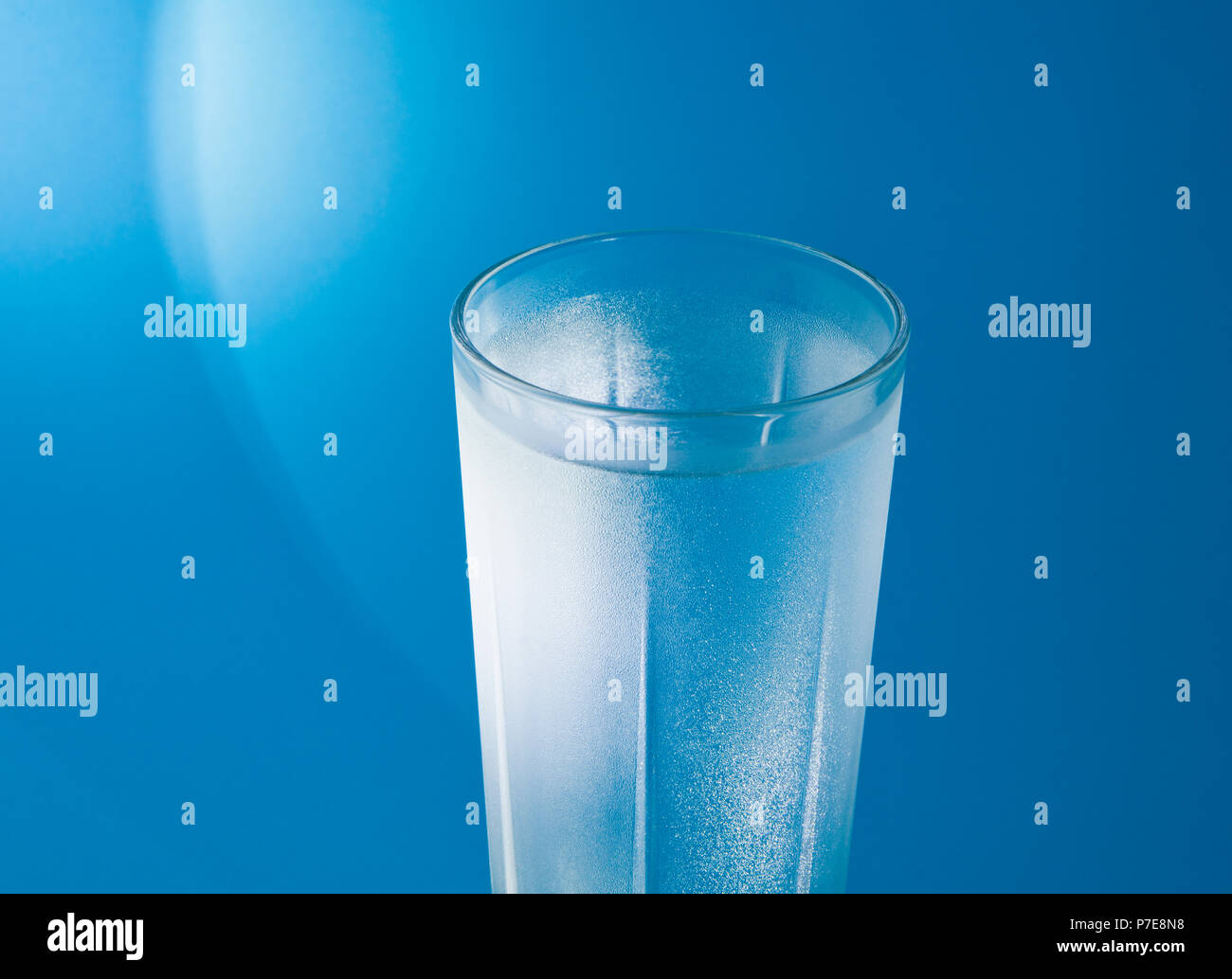 Glass of cold drinking water in soft blue tone with copy space Stock ...
