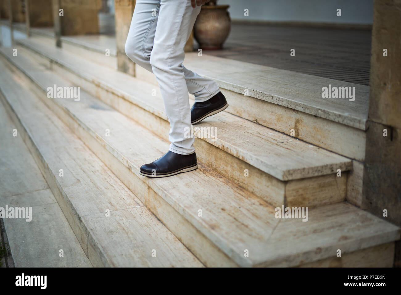 Walking down stairs low angle hi-res stock photography and images - Alamy