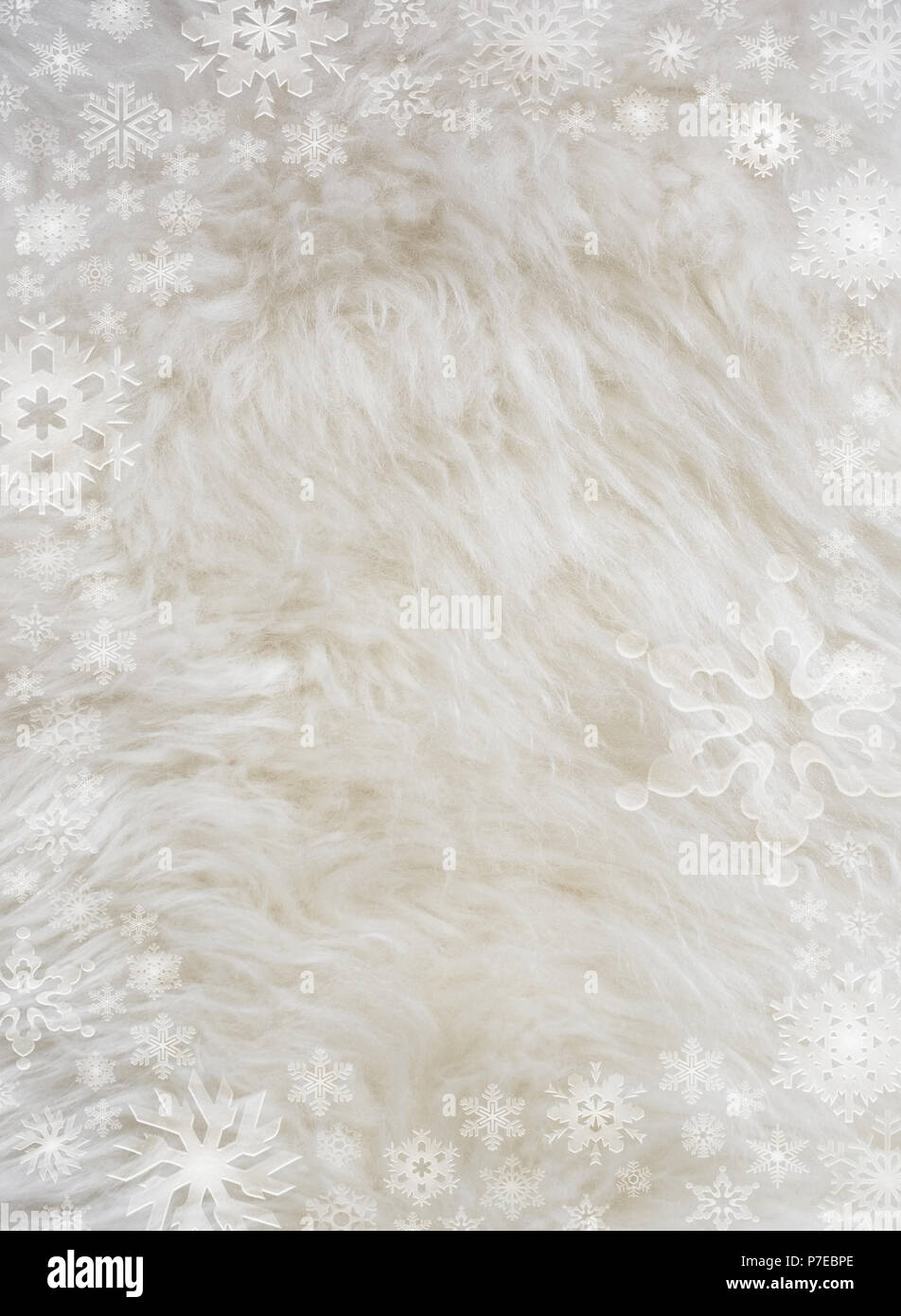 Fluffy white furry sheepskin and snowflakes christmas winter background ...