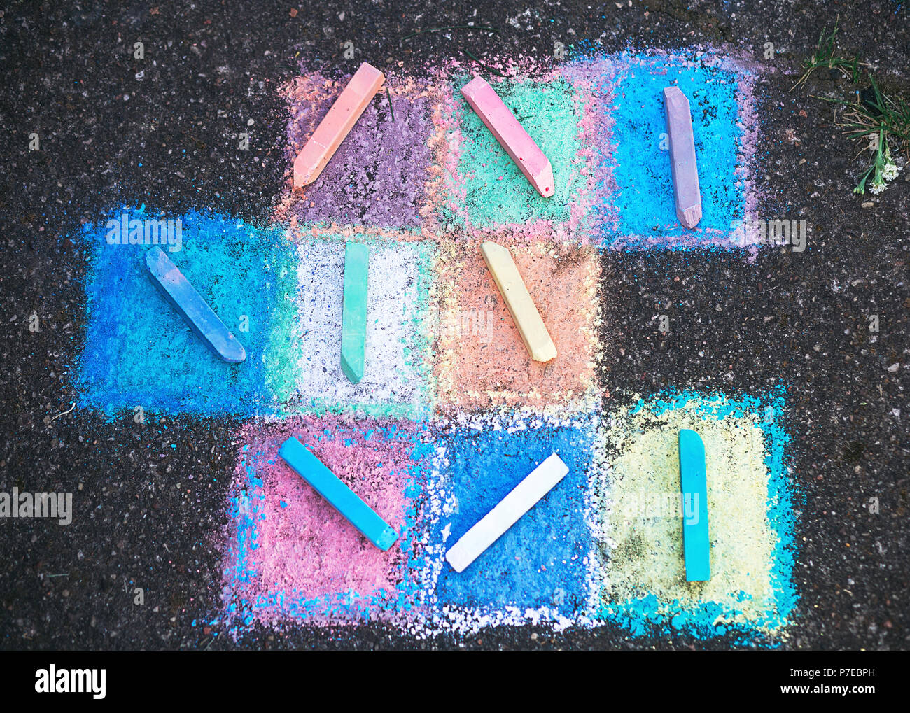 Children drawing on a pavement with chalk hi-res stock photography and ...