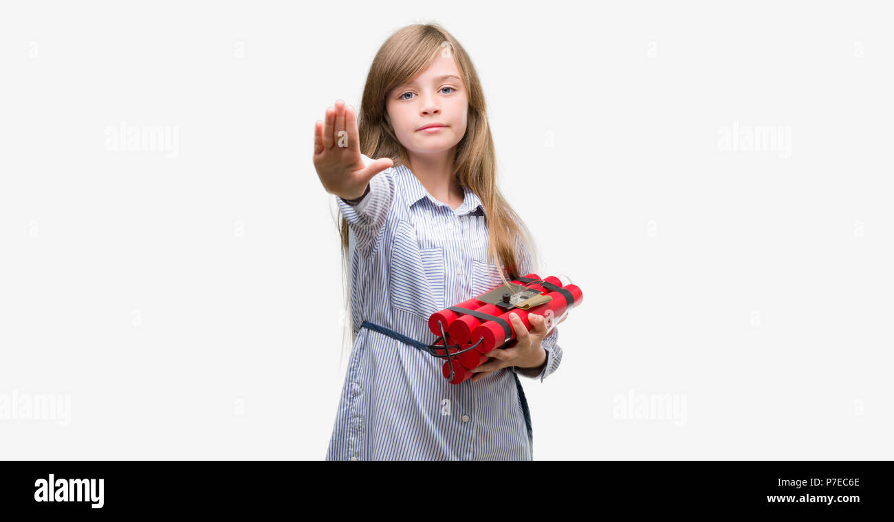 Young blonde child holding dynamite bomb with open hand doing stop sign ...