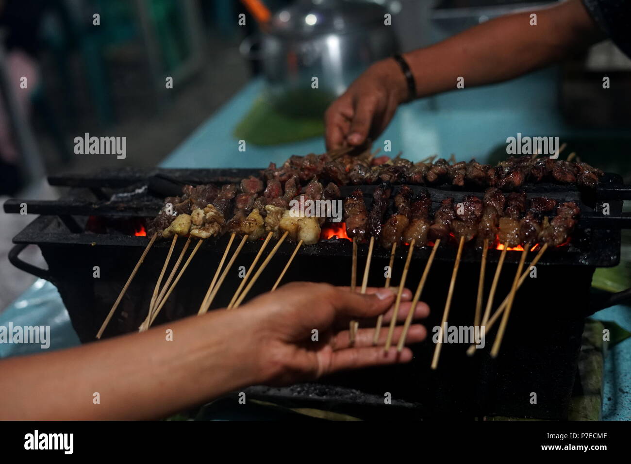 Food Vendor Grilling Meat Satay with charcoal at Street Food Market ...