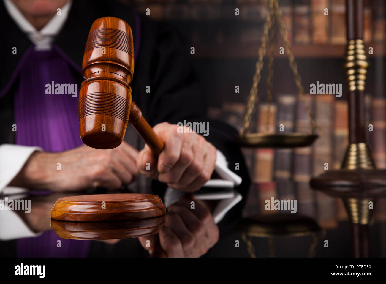 Judge, male judge in a courtroom striking the gavel Stock Photo - Alamy