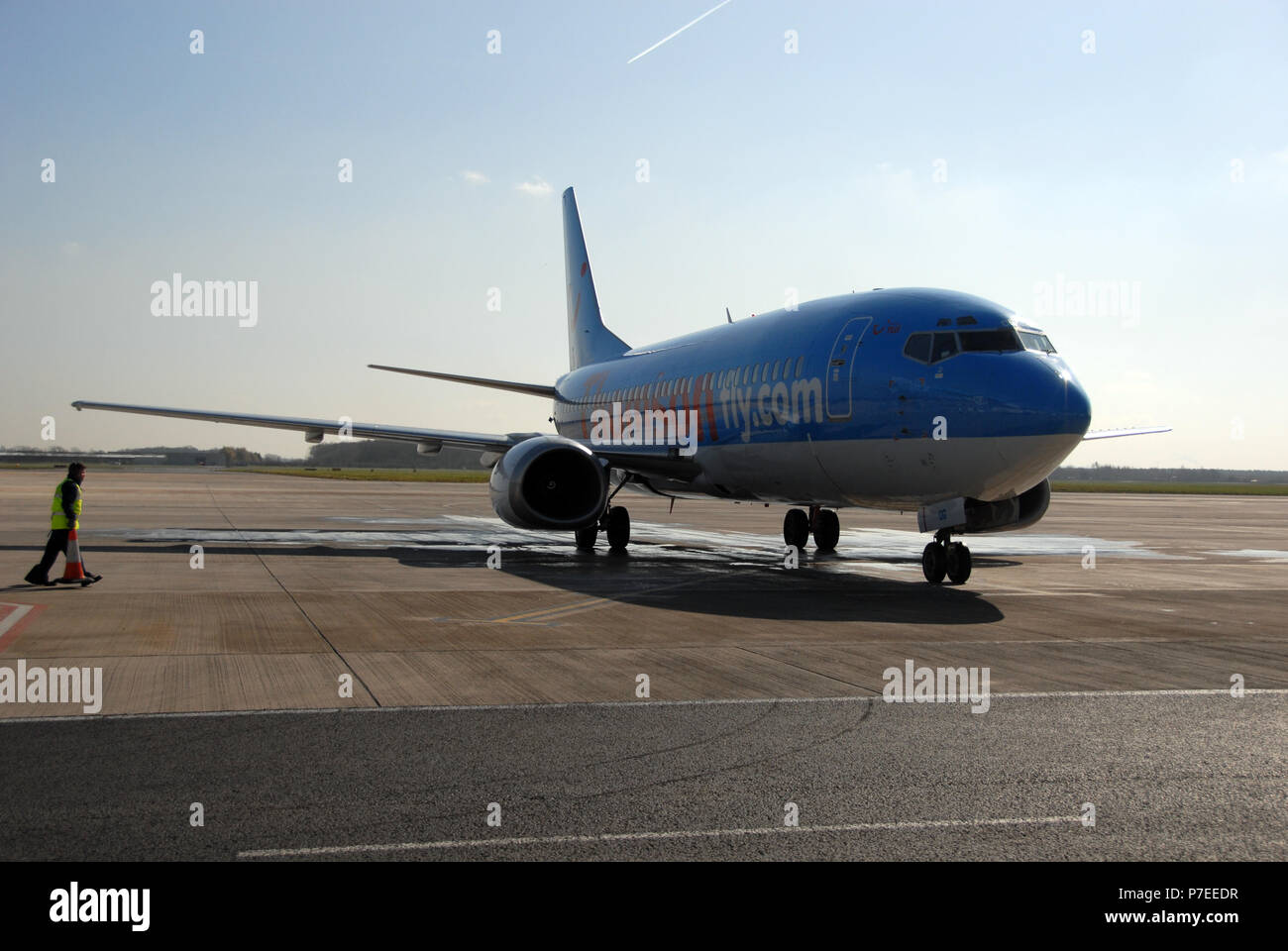 air staff greet a Thomson jet plane on airside tarmac at the Doncaster ...