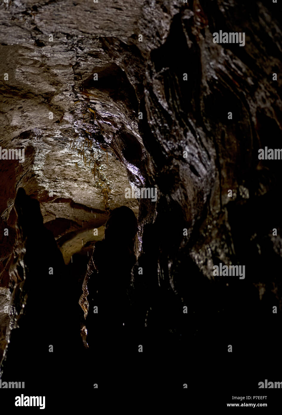 Sheets of flowstone covering the walls of the cave of the Mounds, a ...