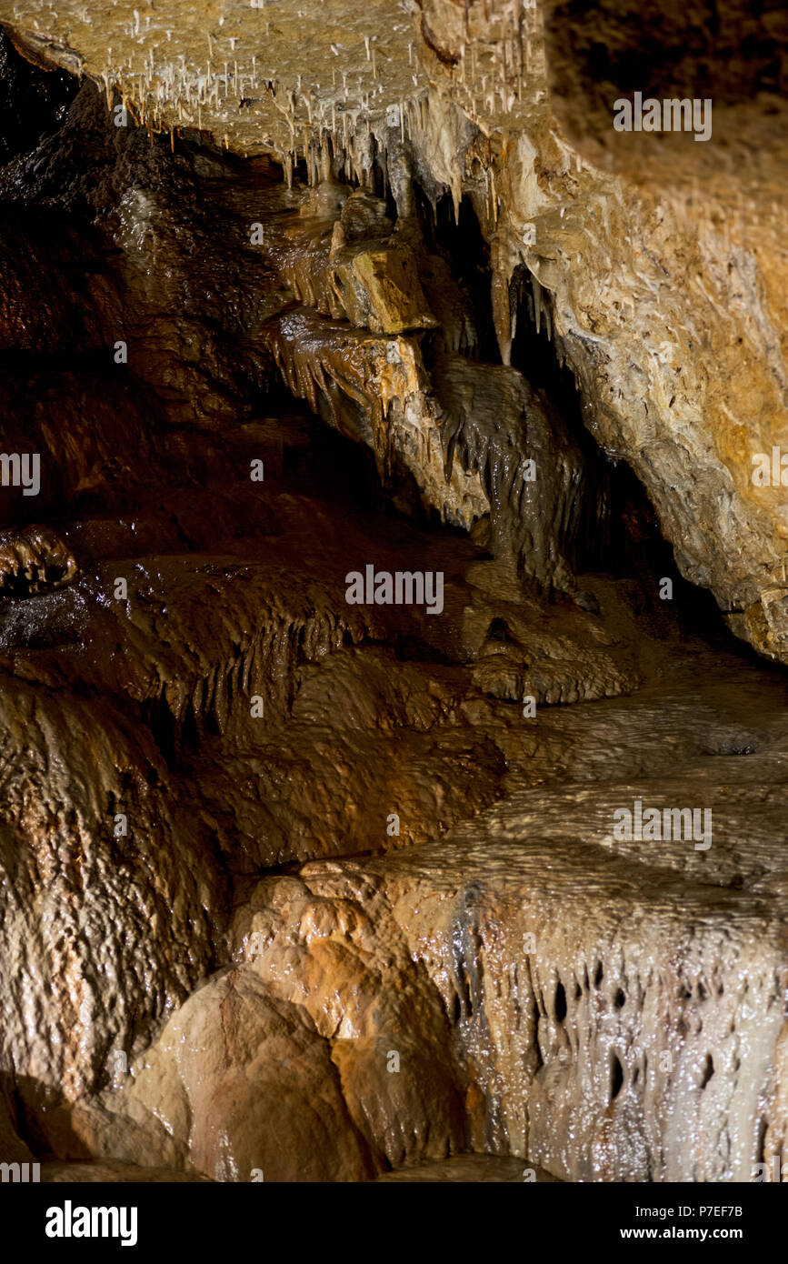 Stalactites and stalagmites inside natural limestone cave. Natural ...