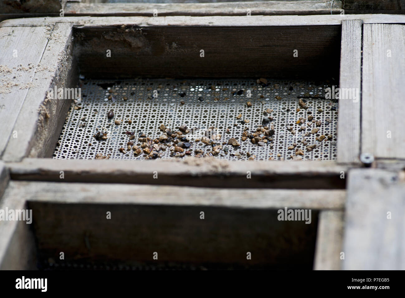 Gemstone panning with a sluice box. Sifting for stones and fossils at ...